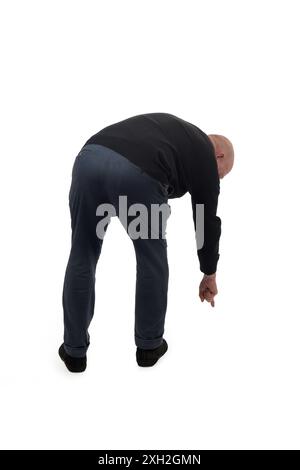 rear view portrait of a crouching man looking down on white background ...
