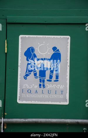 Bilingual Iqaluit Tukisigiarvik Centre sign in English and Inuktitut on ...