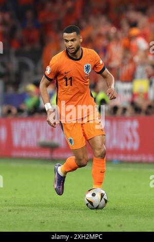 Netherlands' Cody Gakpo runs with the ball during the World Cup Group F ...