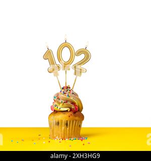 Golden number 102 birthday candle on white background Stock Photo - Alamy