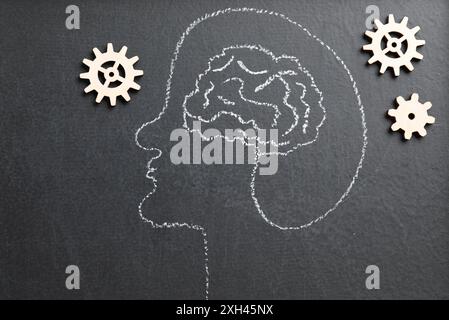 Amnesia problem. Drawing of head, brain and question marks on black ...