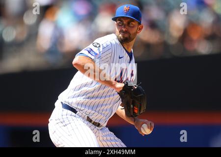 New York Mets pitcher David Peterson (23) throws to the Athletics ...