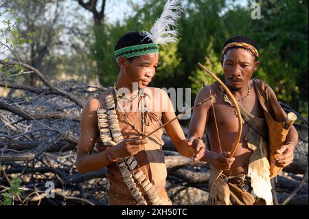 Bushmen hunting with a bow and arrow at the Bushman cultural village ...