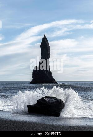 Reynisdrangar spires at Reynisfjara Black Sand Beach, Iceland. A rocky ...