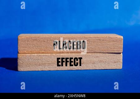 Placebo effect message written on ripped torn green paper piece with ...