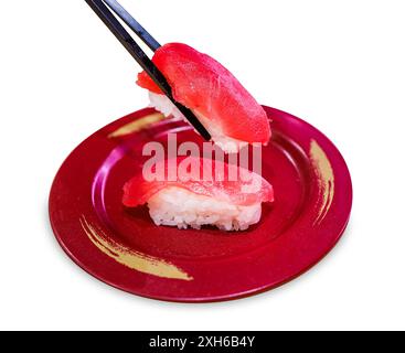 Die cut of Japanese fresh Maguro Maki with Japanese rice in red plate ...