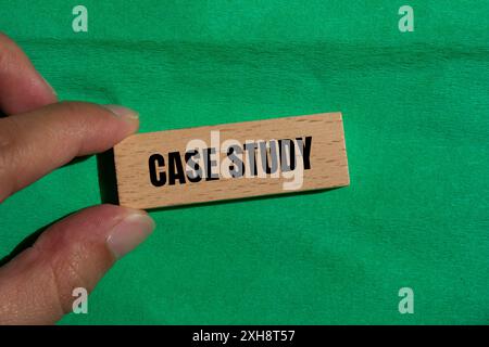 Case study message written on ripped yellow paper with green background. Conceptual case study ...