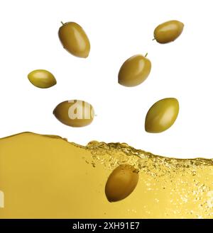 Green olives falling into cooking oil on white background Stock Photo ...