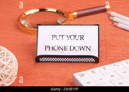Business idea end telephone connection. PUT YOUR PHONE DOWN on a white ...