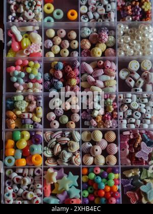 Set of multi-colored beads and beads in a mini plastic bag for ...