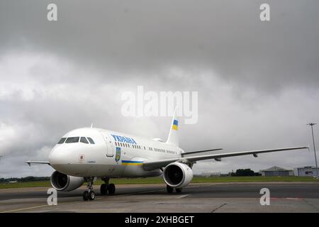 The plane carrying Ukrainian President Volodymyr Zelensky arrives at ...