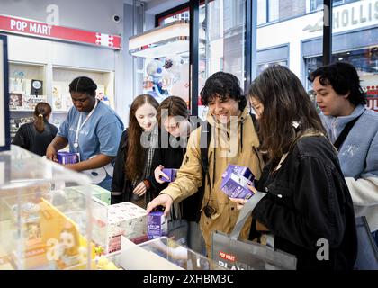 Young people shop at a Pop Mart store in Jiaxing City, east China's ...