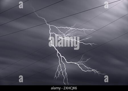 Power lines with lightning in front of a dramatic sky Stock Photo - Alamy