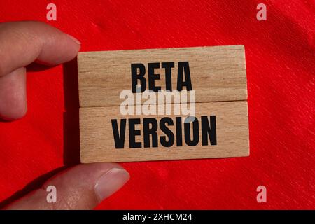Beta version words written on wooden blocks with blue background ...