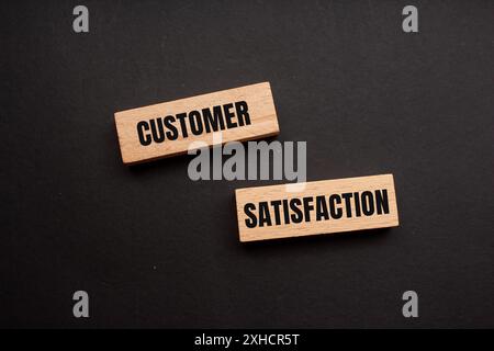 Customer satisfaction message written on ripped paper piece with orange ...