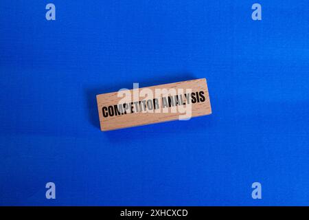 Competitor analysis message written on pink paper with green background ...