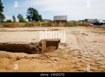 Dugged holes on a construction site. Building house concept Stock Photo ...