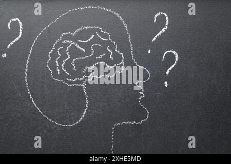 Amnesia problem. Drawing of head and brain on black background, top ...