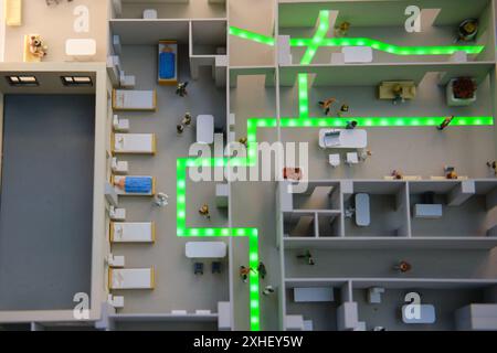 Miniature model of hospital floor plan with medical staff and patients ...