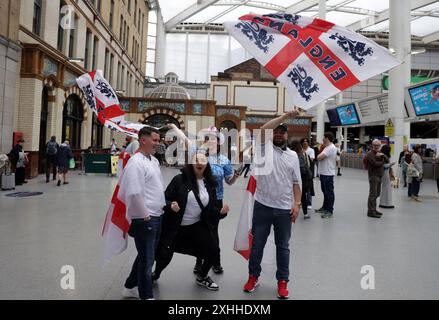 England fans at Victoria train station, Manchester. Picture date ...