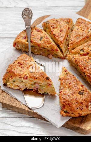 freshly baked Ham and cheese triangle american scones on platter, close ...