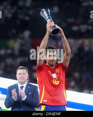 Spain's Rodri with the Player of the Tournament trophy after winning ...