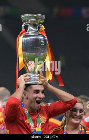 Spain’s Ferran Torres celebrates with the trophy after the UEFA Euro ...