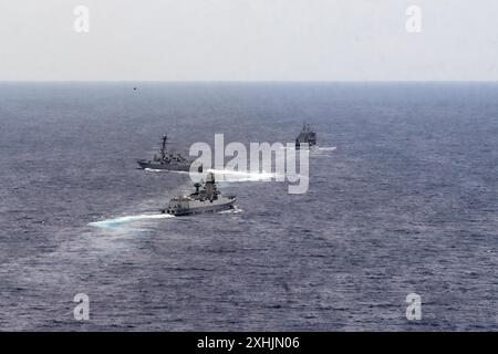 INDIAN OCEAN (July 12, 2024) From front to back: The Arleigh Burke ...