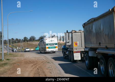 Construction lorries and trucks on Badgerys Creek road moving materials ...