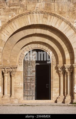 Romanesque portico of St. Maria de Porqueres. Banyoles lake. Girona ...