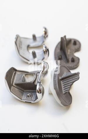 Close-up of various orthopedic knee replacement implants, showcasing ...