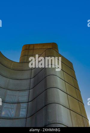 Curved metal warehouse building as abstract architectural background ...