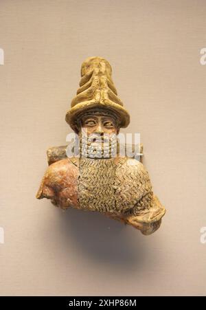 Painted fired clay statue of a seated god. British Museum, London ...