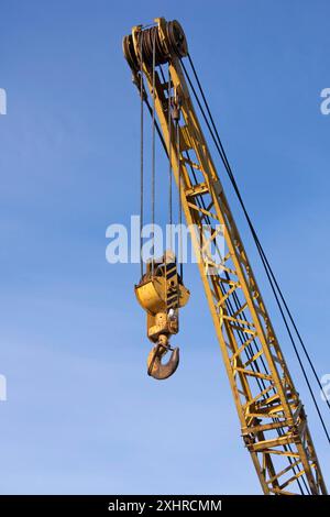 Tower crane with steel hook building metal construction Stock Photo - Alamy