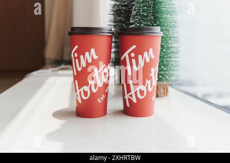 DUBAI, UAE - 9 AUGUST 2020: Tim Hortons takeaway red coffee cup with ...
