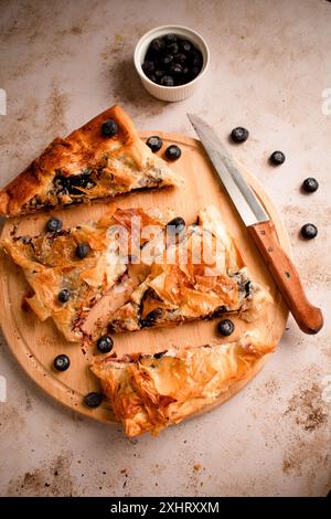 Croissant filled with cream and fresh berries on a plate Stock Photo ...