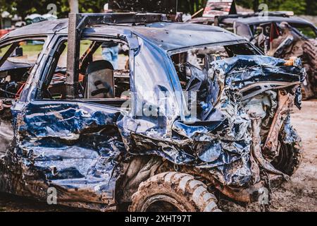 Dented and damaged rear end of a modified car used for a demolition ...