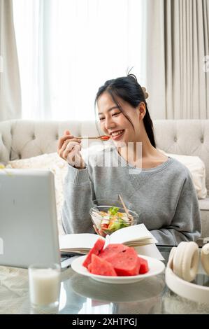 Working remotely in a cozy home office surrounded by greenery while on ...