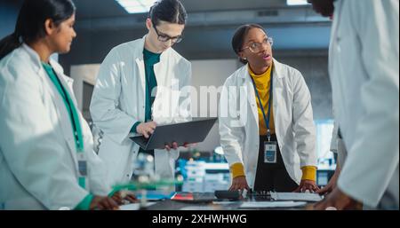 Gathered around to discuss ideas. a group of diverse businesspeople ...