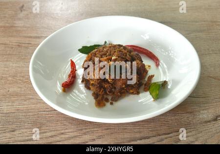 spicy fried chop fermenting fish with herb and chili on plate Stock ...