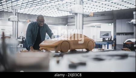 African Automotive Designer Using a Spatula to Create a Prototype Car ...