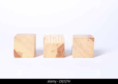 Three blank wooden cubes on top of table, top view. Free text and copy ...