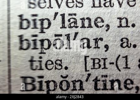 Word bipolar on dictionary page, macro close-up Stock Photo - Alamy