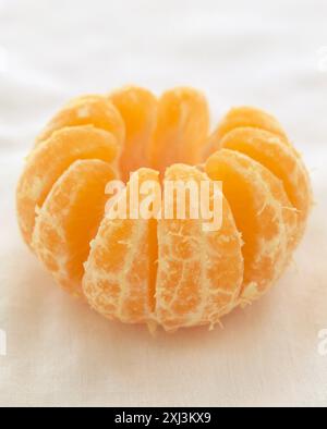 A Mandarin Orange Peeled Open Stock Photo - Alamy