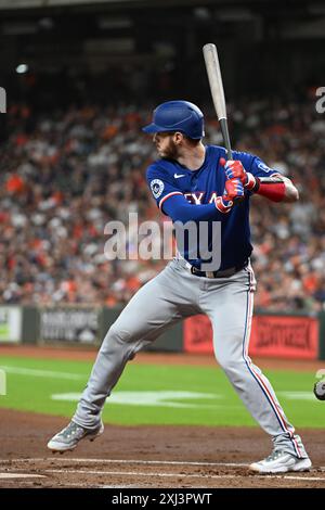 Texas Rangers' Jonah Heim bats during the first inning of a spring ...