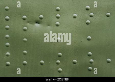 The surface of an old damaged aircraft skin with rivets Stock Photo - Alamy