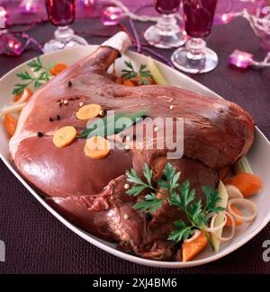 Haunch or leg or raw venison meat isolated on a white studio background ...