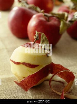 Apple with peeled skin Stock Photo - Alamy