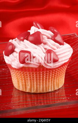 Valentine's Day cupcake decorated with red sugar-coated chocolates ...