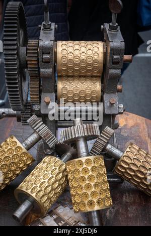 Old embossing machine with profiled metal rollers, machine parts ...